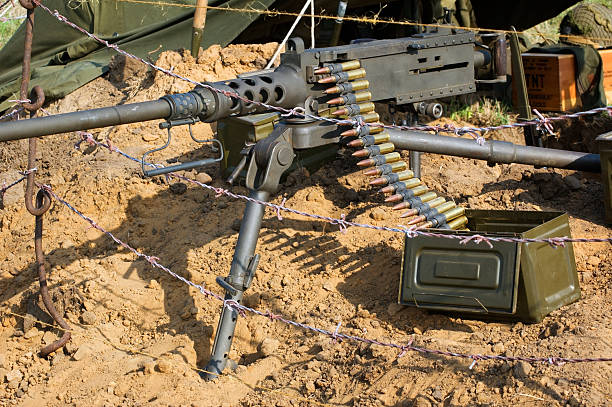 Vintage machine gun and ammunition box in historic military encampment ...