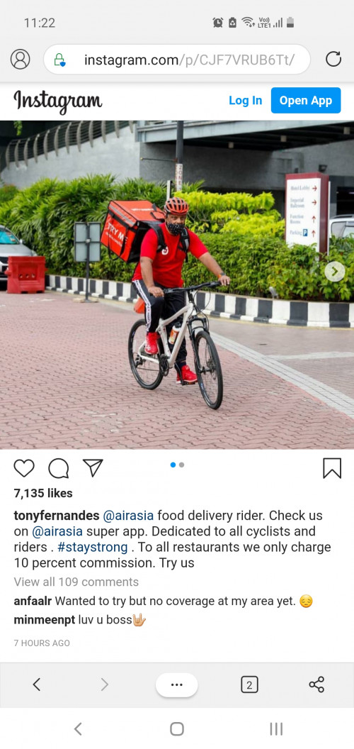 Tony Fernandes riding bicycle with food bag